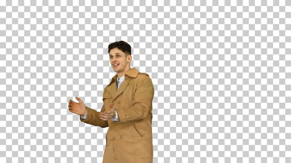 Young man wearing trench coat dancing and having fun, Alpha Channel ...