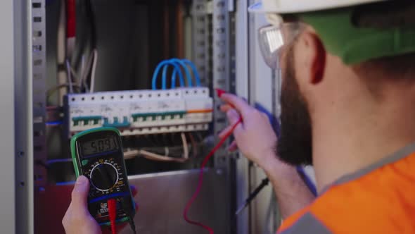 Electrician Using Multimeter to Check Switchboard, Stock Footage ...