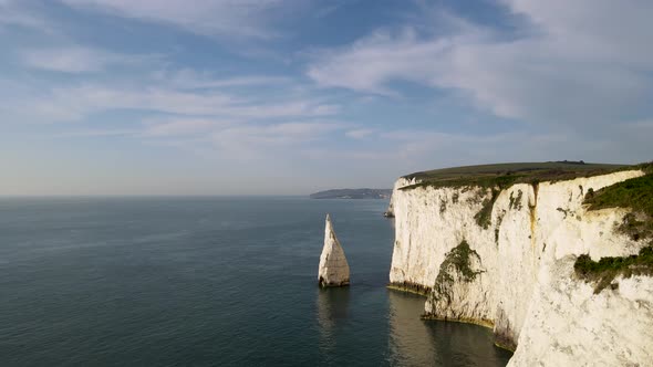 Drone flying along cliff and toward stunning stack, Old Harry Rocks on ...