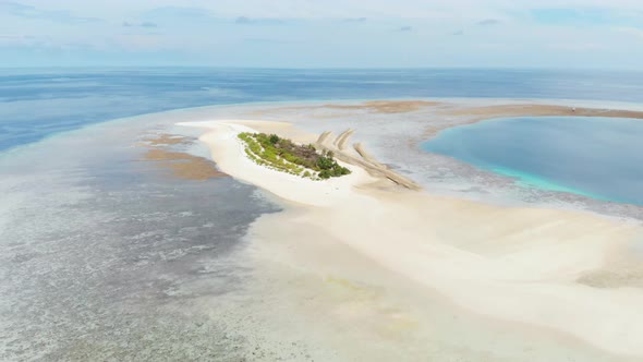 Aerial: Flying over idyllic atoll, scenic travel destination in ...