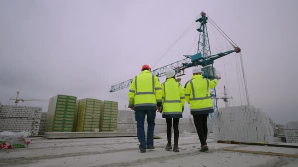 Group of Building Inspectors in Construction Site Civil Engineers and ...