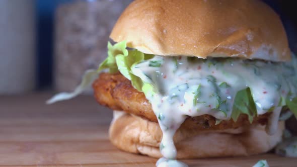Medium Slow Motion Shot of Fish Cake Sliders with Dripping Sauce, Stock ...