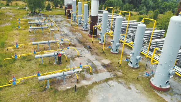 Gas Production, Large Gas Distribution Complex, A Gas Worker or a ...