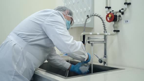 Chemist Washing Glassware in Laboratory Laboratory Employee Worker Wash ...
