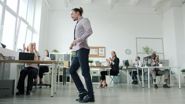 Portrait of Talented Actor Dancing in Workplace Performing for Group of ...
