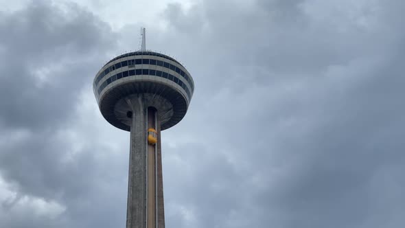 Skylon tower elevator going down niagara falls while raining during day ...