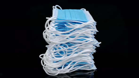 Stacks medical masks rotating isolated on black background, Coronavirus ...