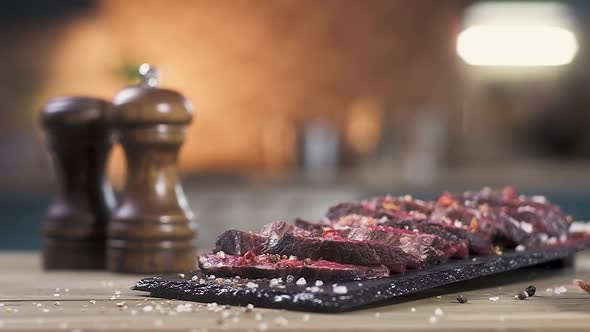 cook sprinkle pepper and salt with his hands , Stock Footage | VideoHive