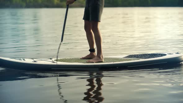 Strong Man Swim Surfing Boat Fitness Workout With Oar. Travel Water ...