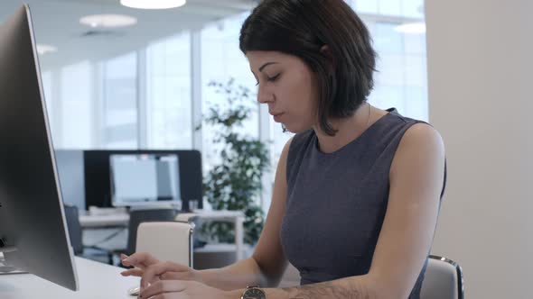 Young Female Clerk Typing on Computer, Stock Footage | VideoHive