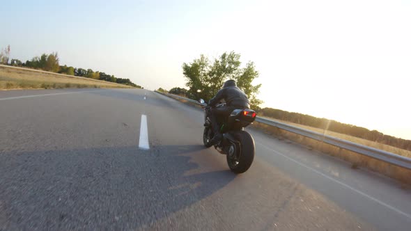 Follow to Biker Riding on Modern Sport Motorbike at Highway During ...