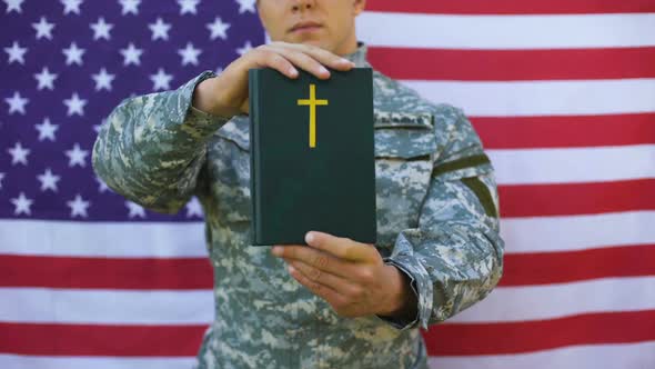 Military Peacekeeper Showing Bible, American Flag Background, Faith ...