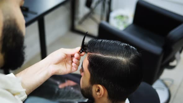 Barber Clips a Part of the Hair Before Cutting, Stock Footage | VideoHive