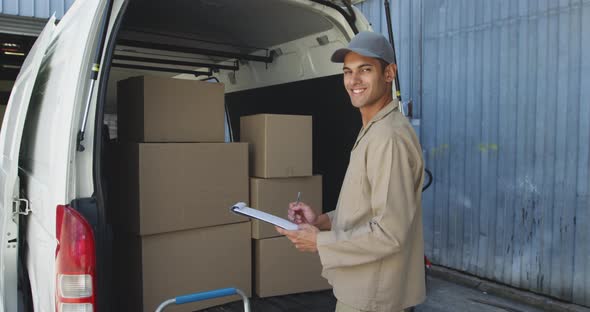 Portrait of a male van driver with a warehouse delivery, Stock Footage