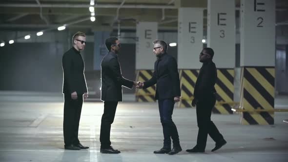 Confident Mafia Man Walking in Parking Lot , Stock Footage | VideoHive