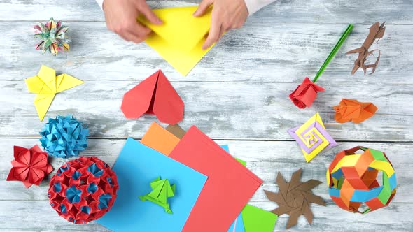 Man Bend Paper To Make Origami, Stock Footage | VideoHive