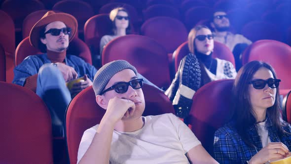 People are Throwing Popcorn at Each Other in the Cinema, Stock Footage