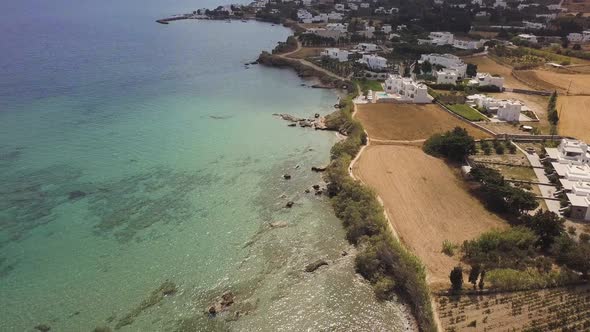 Rotating bird’s eye view of the coastline on the greek island of Paros ...