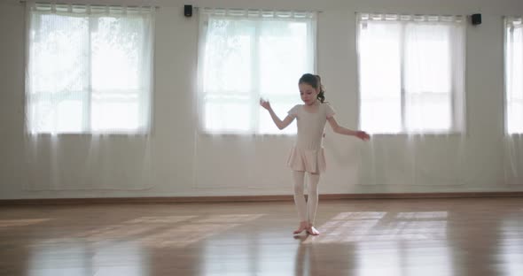 Little girl dancing alone in a studio, Stock Footage | VideoHive