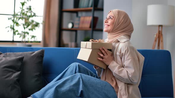 Anticipate Smiling Saudi Woman Opening Festive Gift Box Celebrating ...