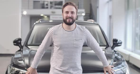 Happy Bearded Caucasian Guy in Stripped Sweater Posing with New Black ...
