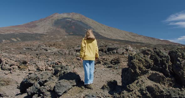 Female Traveller Looking at Volcanic Rocky Landscape Against Teide ...