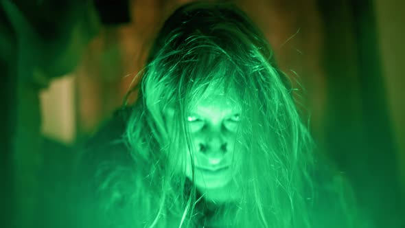 Scary ghost woman screaming through dirty glass on dark background ...