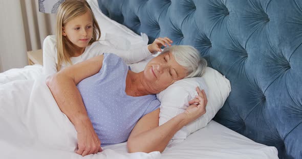 Granddaughter waking up her grandmother, Stock Footage | VideoHive