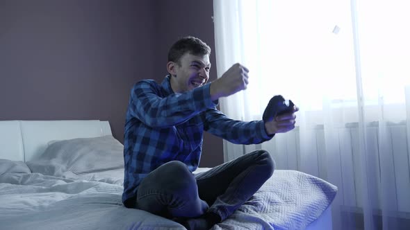 Man holding video game console controlling joystick, playing games ...