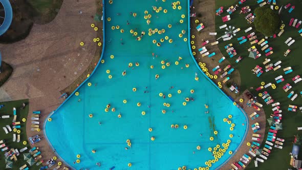 Crowd of people relaxes in the city open-air water park, people swim in ...