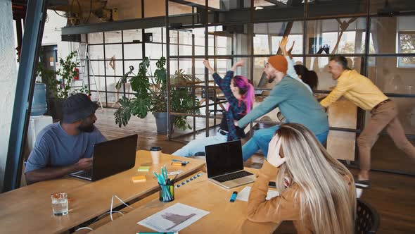 Diverse Managers Watching Their Colleagues Competing in Office Chair ...