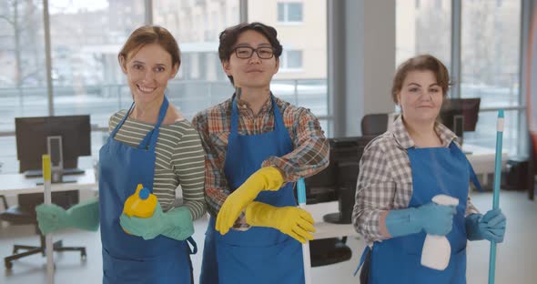 Portrait of Diverse Cleaning Team in Uniform Posing at Camera Holding ...