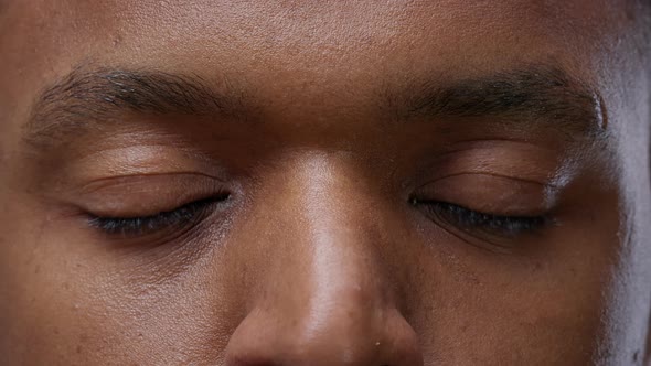 African American Person Blinking in Front of Camera, Stock Footage
