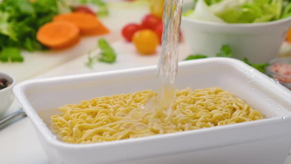 Hot Water Pouring Into Dry Instant Noodles, Stock Footage | VideoHive