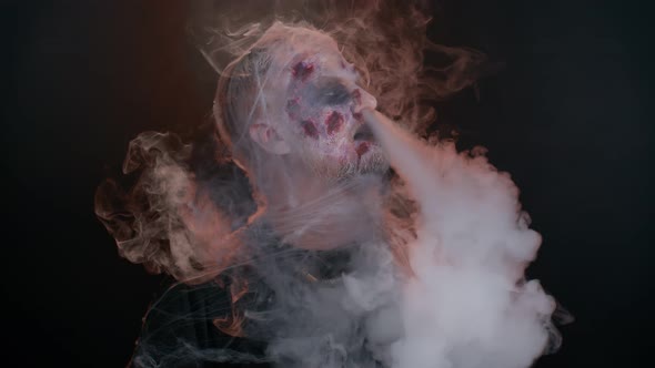Creepy Man Scary Wounded Halloween Undead Guy Blows Smoke From Nose and ...