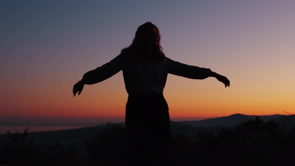 silhouette of girl dancing with open arms, Stock Footage | VideoHive
