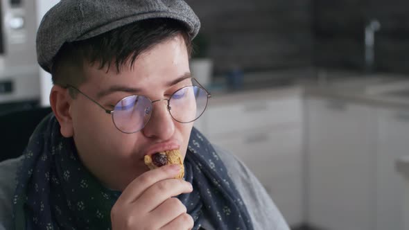 Man Eating Cookie Smiling on Camera, Stock Footage | VideoHive