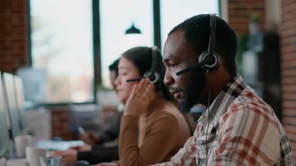 Male Worker Answering Telework Phone at Call Center, Stock Footage