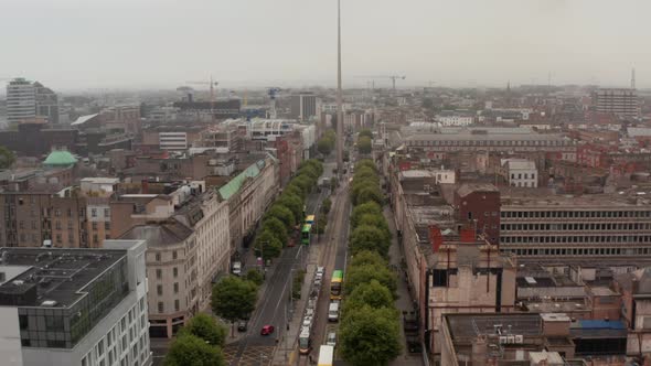 Ascending Footage of Wide Boulevard with Tree Alley Leading Through ...