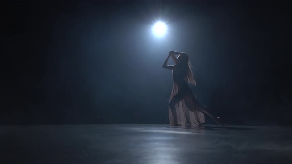 Motion of an Elegant Lady Dancing Contemp in Dark Studio., Stock Footage