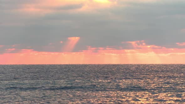 Dramatic orange sun rays above a windy ocean, Stock Footage | VideoHive