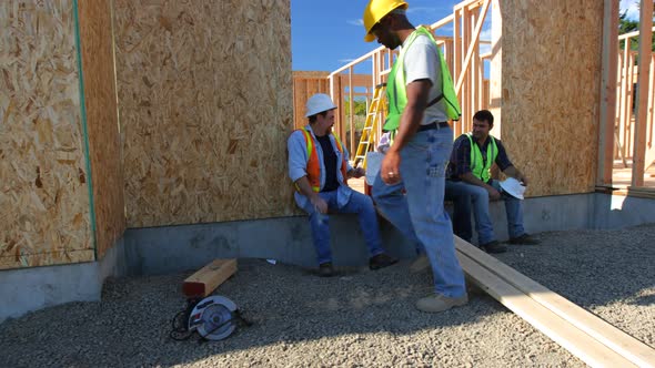 Group of construction workers taking a break, Stock Footage | VideoHive