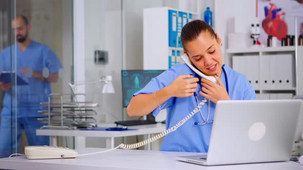 Physician Nurse Answering Patient Call By Phone, Stock Footage | VideoHive