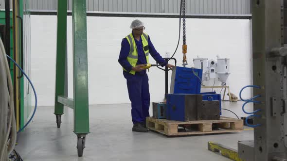 Warehouse worker pulling a warehouse aisle, Stock Footage | VideoHive