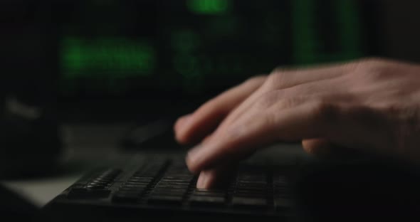 Hacker is Typing Keys on a Keyboard in His Room, Stock Footage | VideoHive