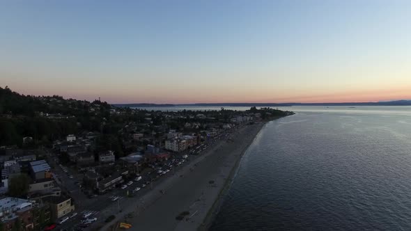Drone lowering over Seattle's Alki Beach during a summer sunset., Stock ...
