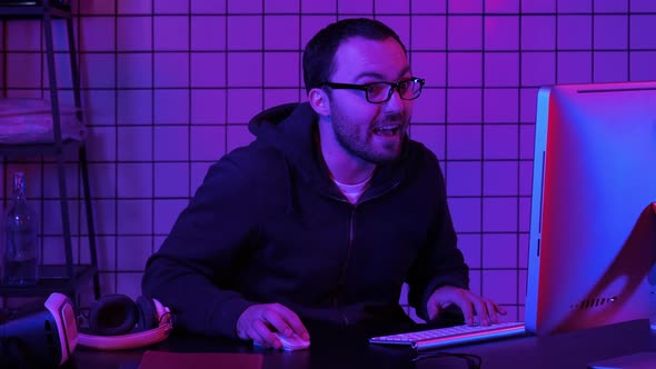 Gamer Playing a Game Very Excited and Commenting on the Game, Stock Footage