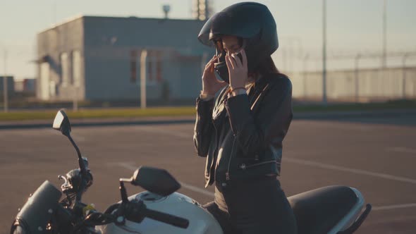 Beautiful Young Redhaired Woman Motorcyclist Dancing on Her Custom Bike ...