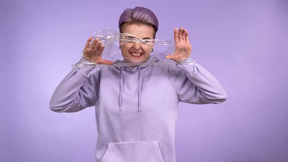 Young Woman Wrapped Around Synthetic Tearing Plastic Breaking Free by ...