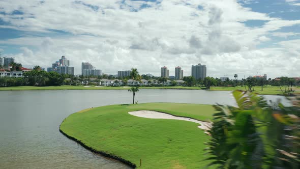 Cinematic Aerial View of Green Golf Course at the Scenic Lake, Miami ...
